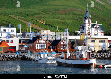 Boats, colorful buildings and church, Husavik Harbor, Husavik, Iceland ...