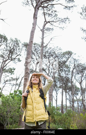 Woman observing something Stock Photo - Alamy