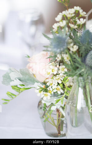 Table set for an event party or wedding reception decorated with pearls ...