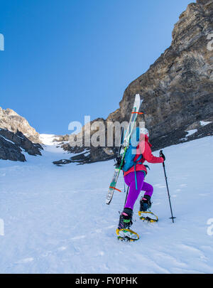 Ski mountaineer ascending to the summit of the "Super Gully" on Lost ...
