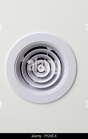 Round air vent on a white wall close to the floor Stock Photo - Alamy