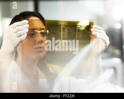 Protective gloves plastic goggles on wooden board Stock Photo - Alamy