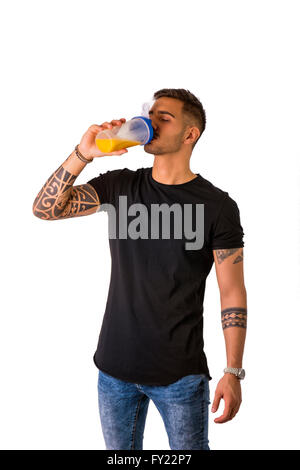 Young tattooed adult man showing and pointing up with fingers number ...