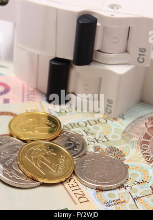 Electric fuse and money on electrical construction drawing of house ...