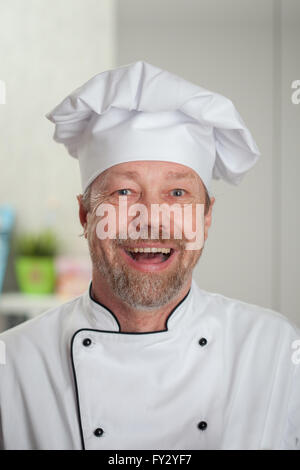 Cook in the White Cap laughs Stock Photo - Alamy