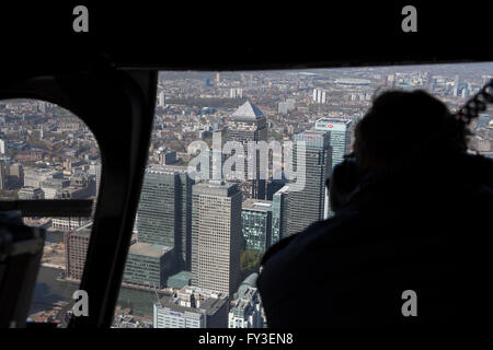 View from inside of Helicopter with door open over London during aerial ...