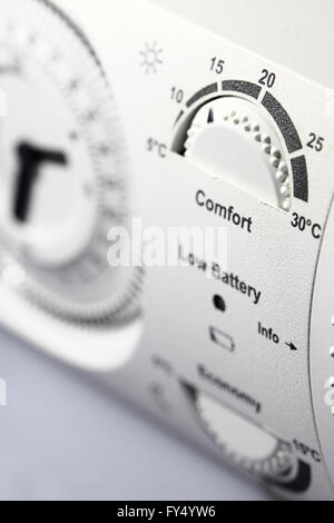 Central heating programmable timer control unit on white background ...