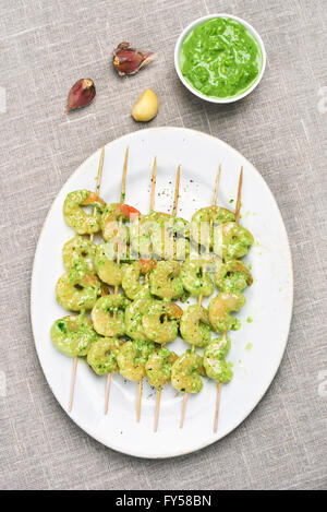 Raw fresh shrimp marinated in fish sauce and garlic served on metal ...