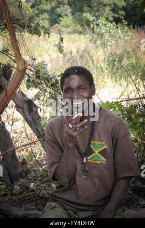 African man smoking Stock Photo - Alamy