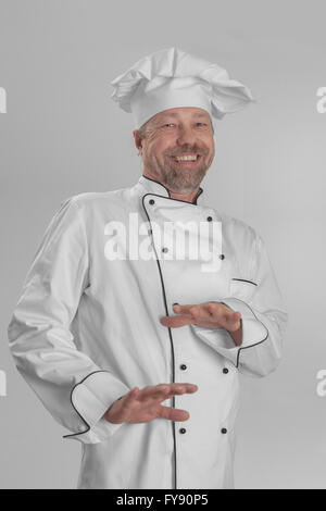 Cute little chef in kitchen Stock Photo - Alamy