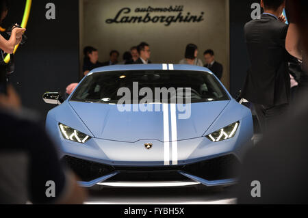 Beijing, China. 25th Apr, 2016. Visitors watch an Audi car at the 2016 ...