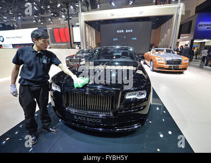 Beijing, China. 25th Apr, 2016. Visitors watch an Audi car at the 2016 ...