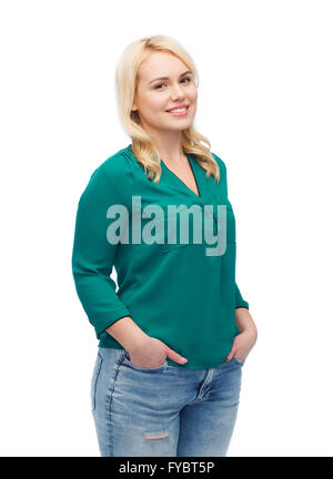 smiling overweight woman in jeans measuring waist with measuring tape ...