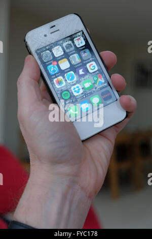 Cracked damaged iPhone 4S Stock Photo - Alamy