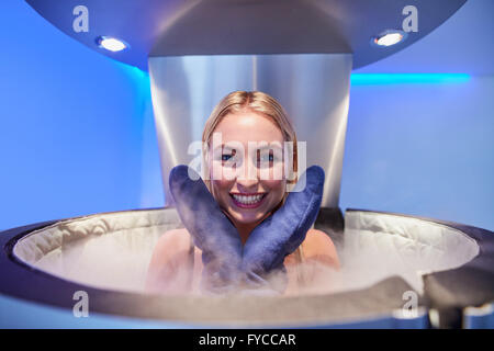 Woman in cryosauna booth for whole body cryotherapy. Caucasian female ...