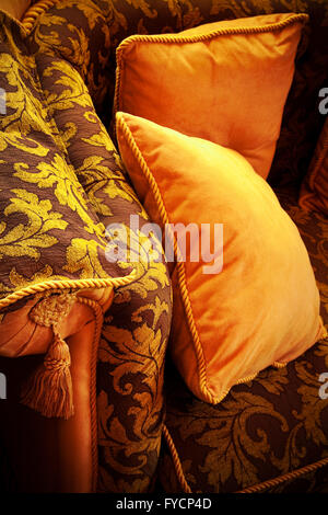 orange fabric sofa couch furniture in living room near wood wall Stock ...