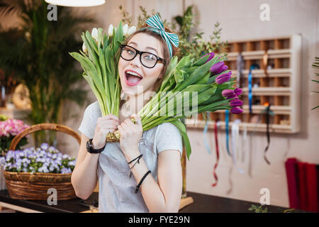 Self-portrait of attractive cheerful funny woman sending you air kiss ...