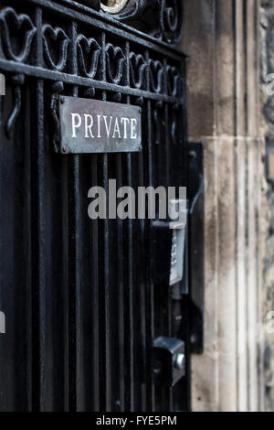 Black iron gate with private sign Stock Photo - Alamy