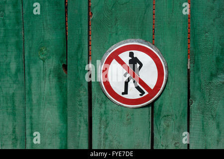 Passage prohibited. Sign hanging on the fence the danger zone of ...