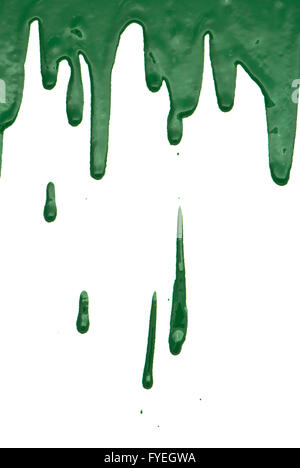 Green paint pouring on white background Stock Photo - Alamy