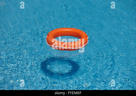 Life preserver rings in orange color stacked, isolated on white Stock ...