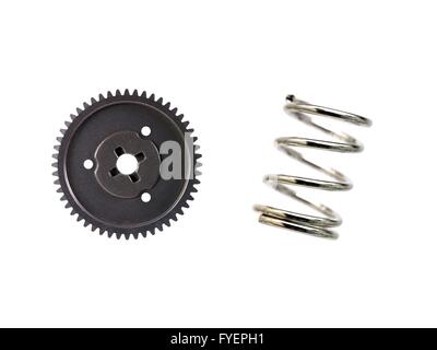 A spring and cog isolated against a white background Stock Photo - Alamy