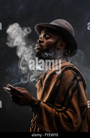 A young Rapper smoking a cigarette Stock Photo - Alamy