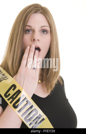 Woman wrapped in danger tape Stock Photo - Alamy