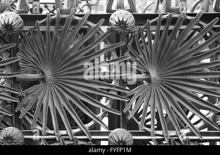 A metal fence designed by Anton Gaudi in Parc Guell in Barcelona in the ...