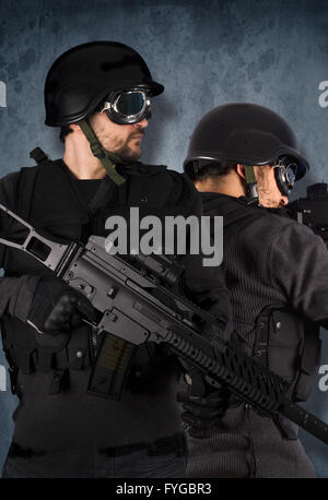 Studio shot of SWAT police special forces in black uniforms Stock Photo ...