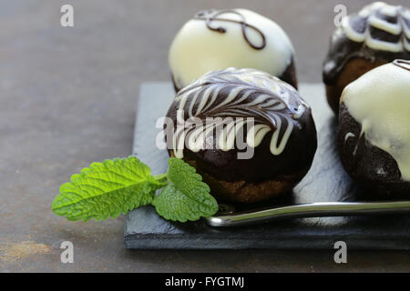 dessert biscuit balls cakes with chocolate icing Stock Photo - Alamy