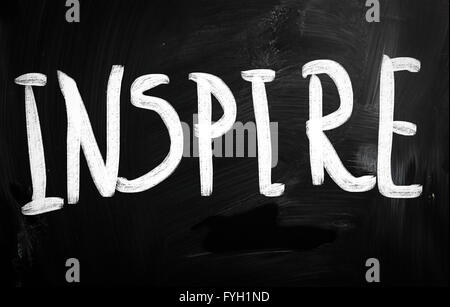 Inspire handwritten with white chalk on a blackboard Stock Photo - Alamy