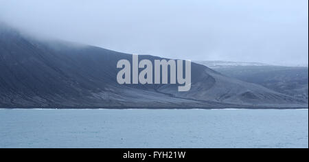 The black volcanic slopes of Saunders Island. The slopes of black ...