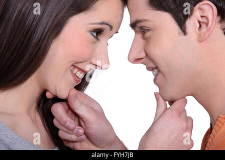 Young couple gazing lovingly into each other's eyes Stock Photo - Alamy