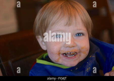 Baby eating peanut butter Stock Photo - Alamy