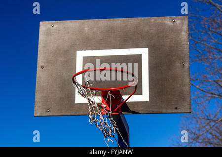 Basketball backboard on blue sky background. Rustic outdoor sport ...