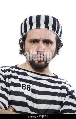 Locked, Desperate, portrait of a man prisoner in prison garb, over ...