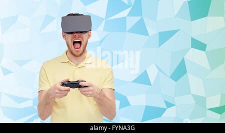 angry man in virtual reality headset with gamepad Stock Photo - Alamy