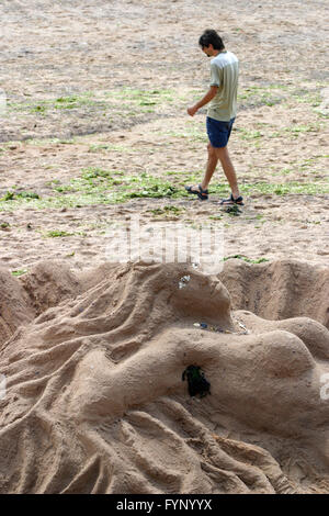 Sculpture of a mermaid with sand on the beach Stock Photo - Alamy