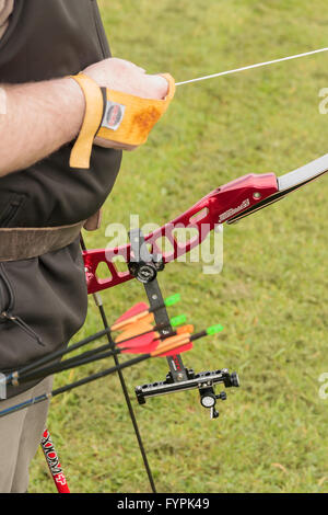 Sports target bow and arrows at the standing line on an archery Stock ...