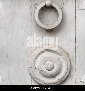 Detail embossed metal handle and an old door Stock Photo - Alamy