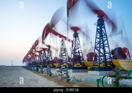 oil-rig of oilfield day and night Stock Photo - Alamy