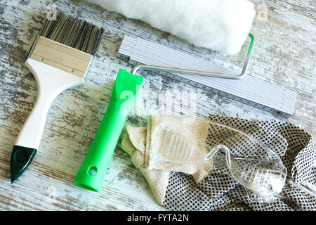 Set of painting tools on wooden board construction concept Stock Photo ...