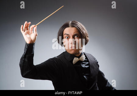 Funny conductor in musical concept Stock Photo - Alamy