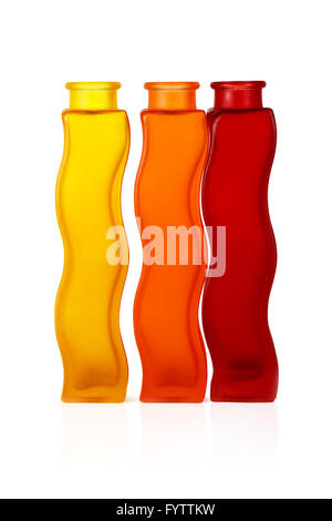 Three colorful glass bottles isolated on a white background. Wine ...