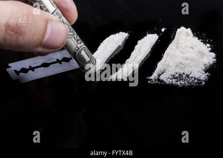 Cocaine, razor blade and rolled dollar bill. Party drugs on the rise ...