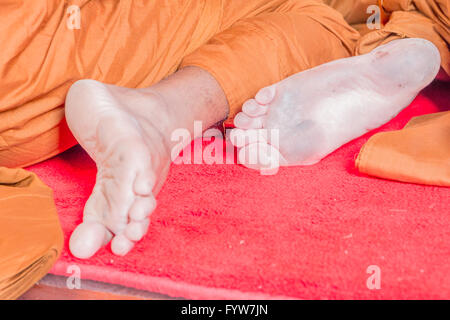 closeup on buddhist monk sole of the foot during praying ceremony ...