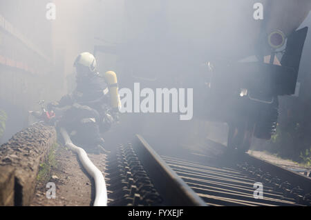 Tanker train fire firefighters Stock Photo - Alamy