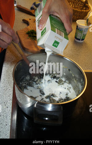 Cooking shaggy ink cap soup Stock Photo - Alamy