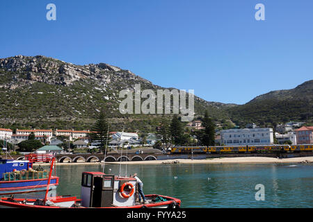 A train passing Kalk Bay harbour near Cape Town in the Western Cape ...